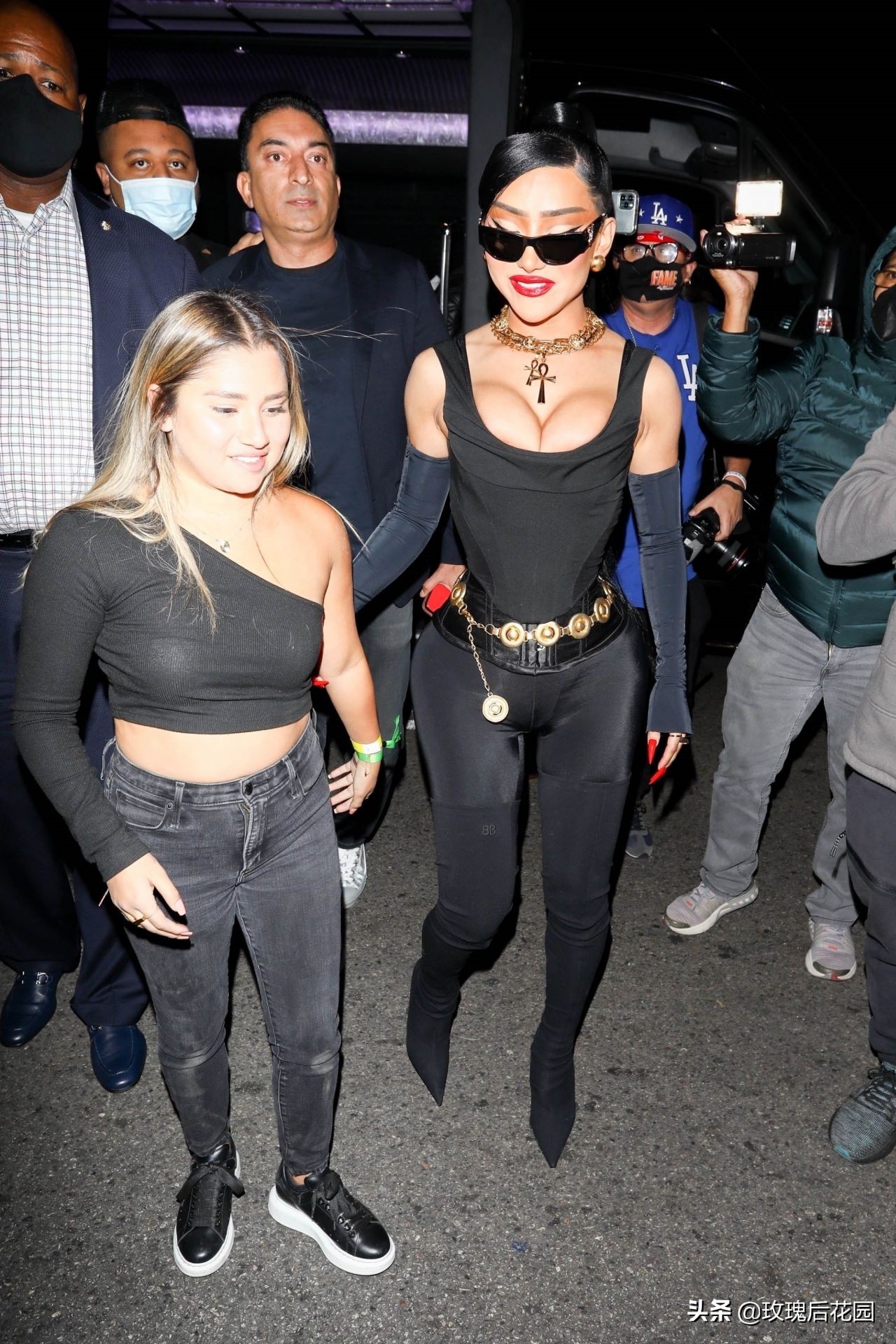 Nikita Dragon arrives at a friend's birthday party, wearing a black ...