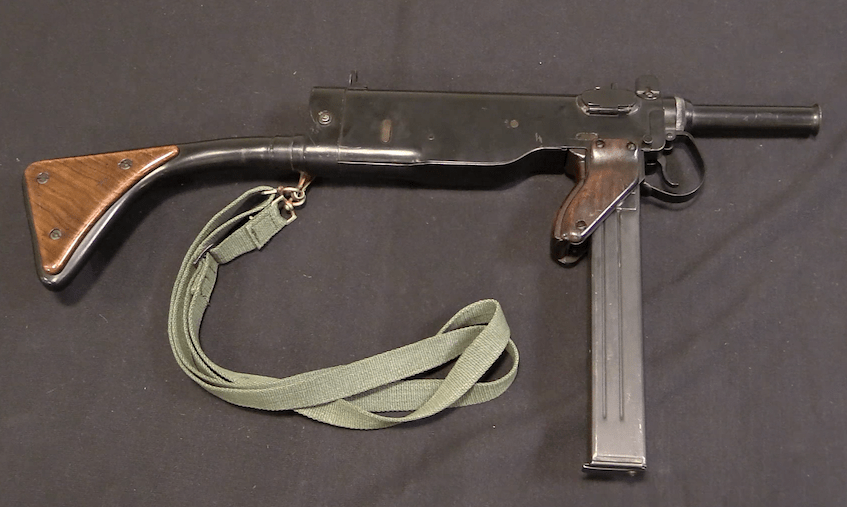A close relative of the Stern submachine gun, the British one-handed ...