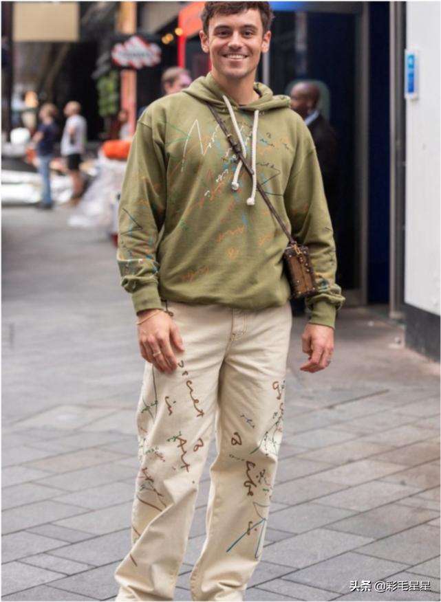 Tom Daly appeared on the streets of London and smiled brightly for the ...