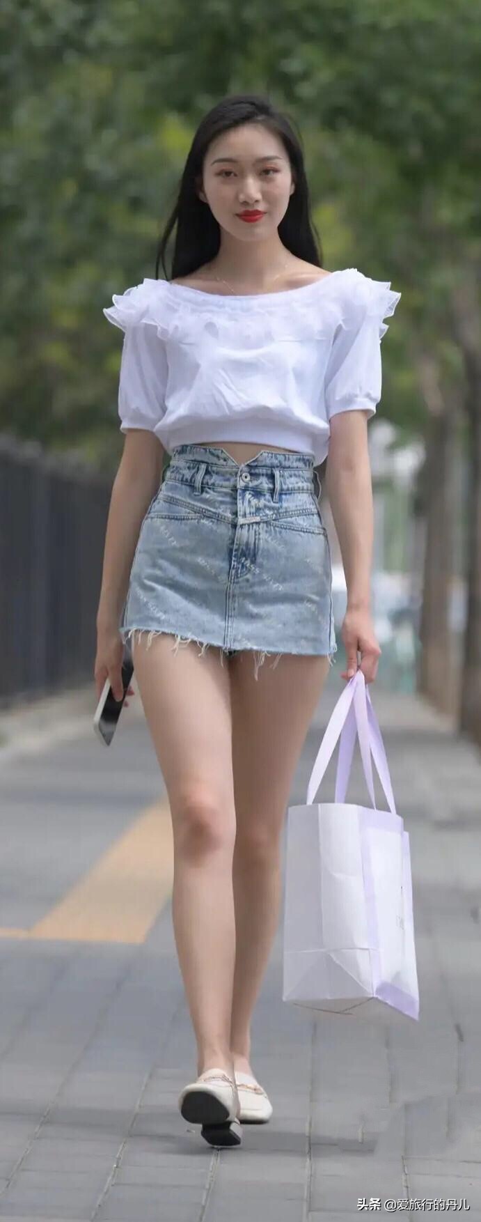 White big round neck shirt with blue denim skirt pants, exuding an ...