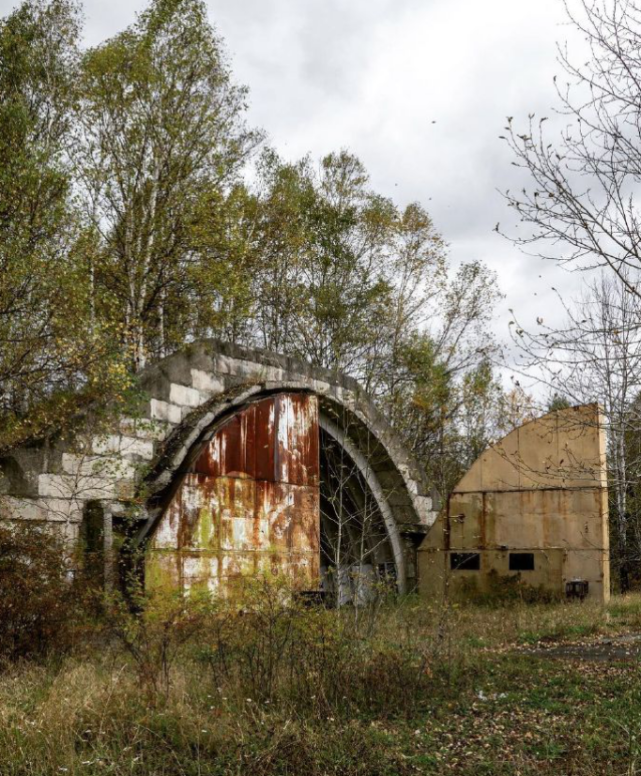 Visiting the abandoned Russian military base, the runway long grass ...