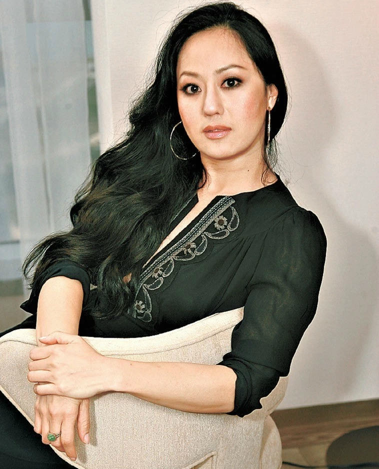 Former Hong Kong socialite Zhang Xiaohui, wearing a couture dress to ...