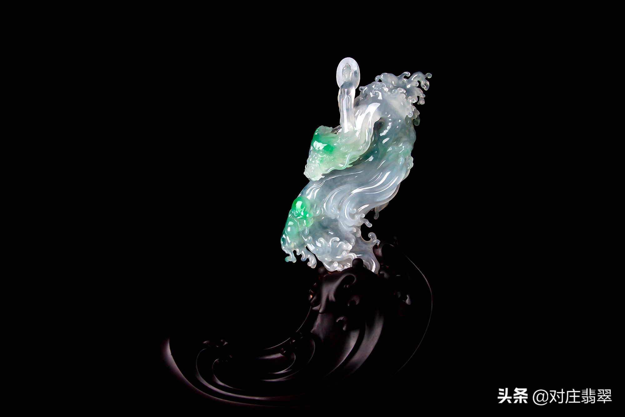 The jade carving of Guanyin with jade dragon head, stands tall and ...