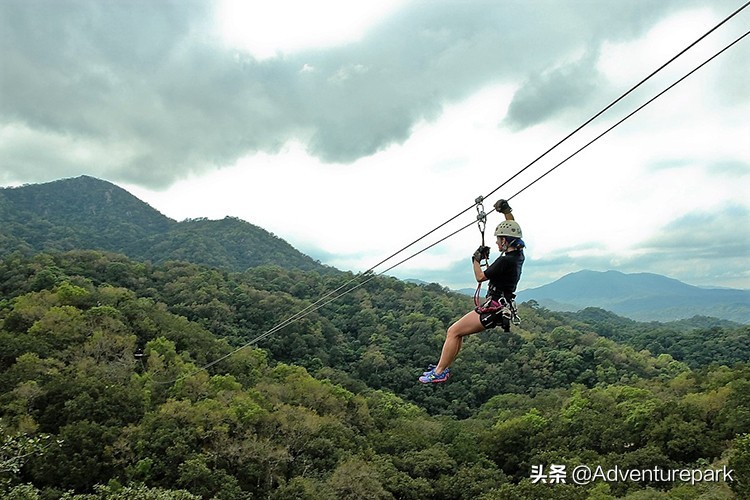 Zipline at high altitude, across mountains and lakes, sliding ...
