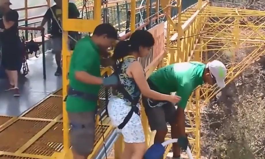 The girl had an accident with bungee jumping, and the rope broke after ...