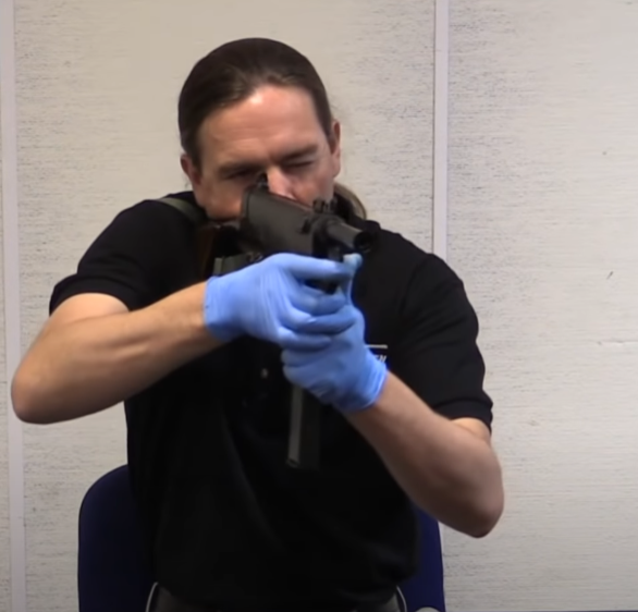 A close relative of the Stern submachine gun, the British one-handed ...