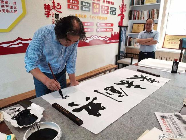 Xinjiang painter and calligrapher Dong Zhongxing writes "We are in the ...