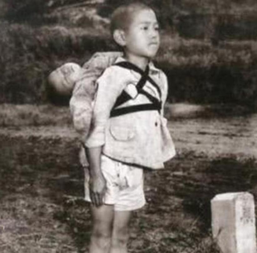 The most famous photo after the atomic bomb: a Japanese boy carrying ...