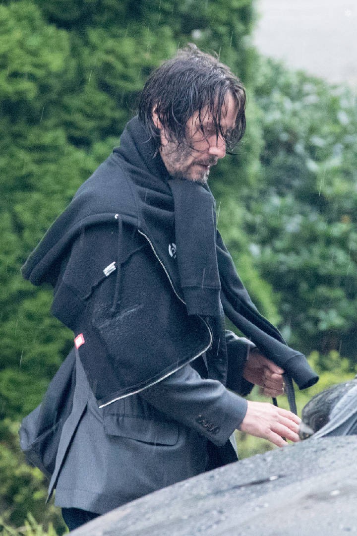 Keanu Reeves has wet hair in the rain. The new film is co-operated with ...