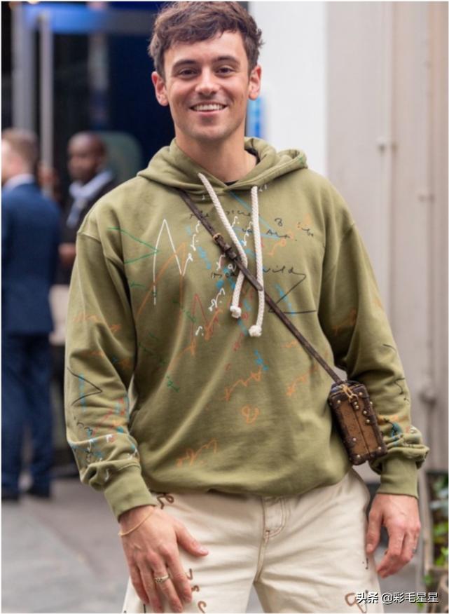 Tom Daly appeared on the streets of London and smiled brightly for the ...