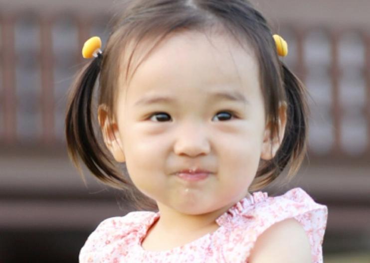 The position of the baby's dimples is different, showing a different ...