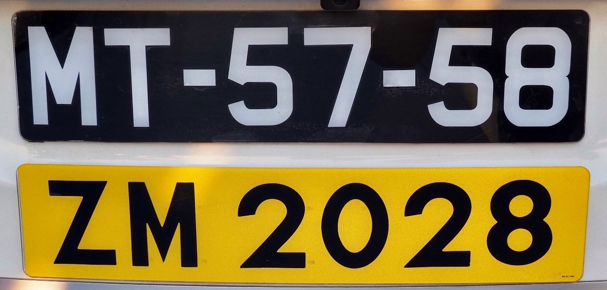 Why does the car have three different license plates, and what do they ...