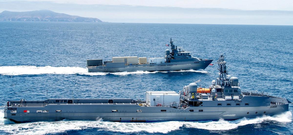 The US military tests unmanned missile boats, carrying containerized ...