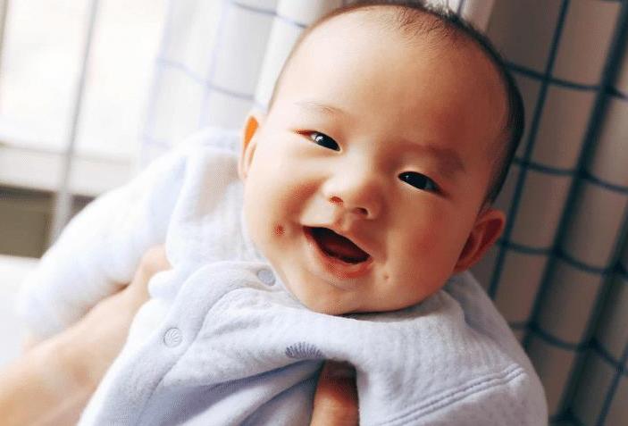 The position of the baby's dimples is different, showing a different ...