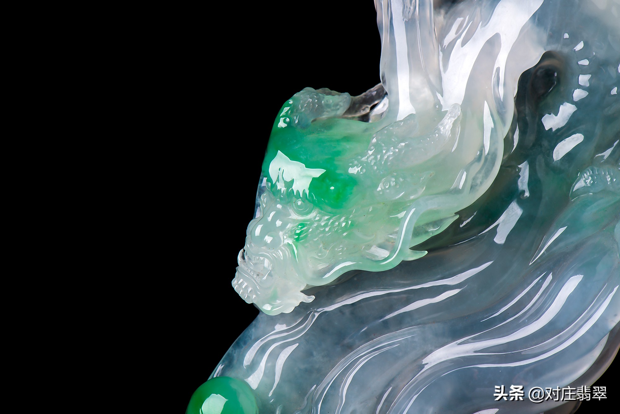 The jade carving of Guanyin with jade dragon head, stands tall and ...