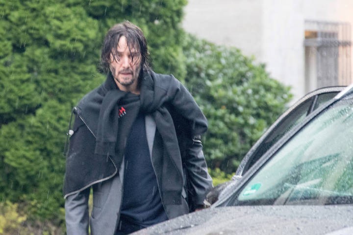 Keanu Reeves has wet hair in the rain. The new film is co-operated with ...